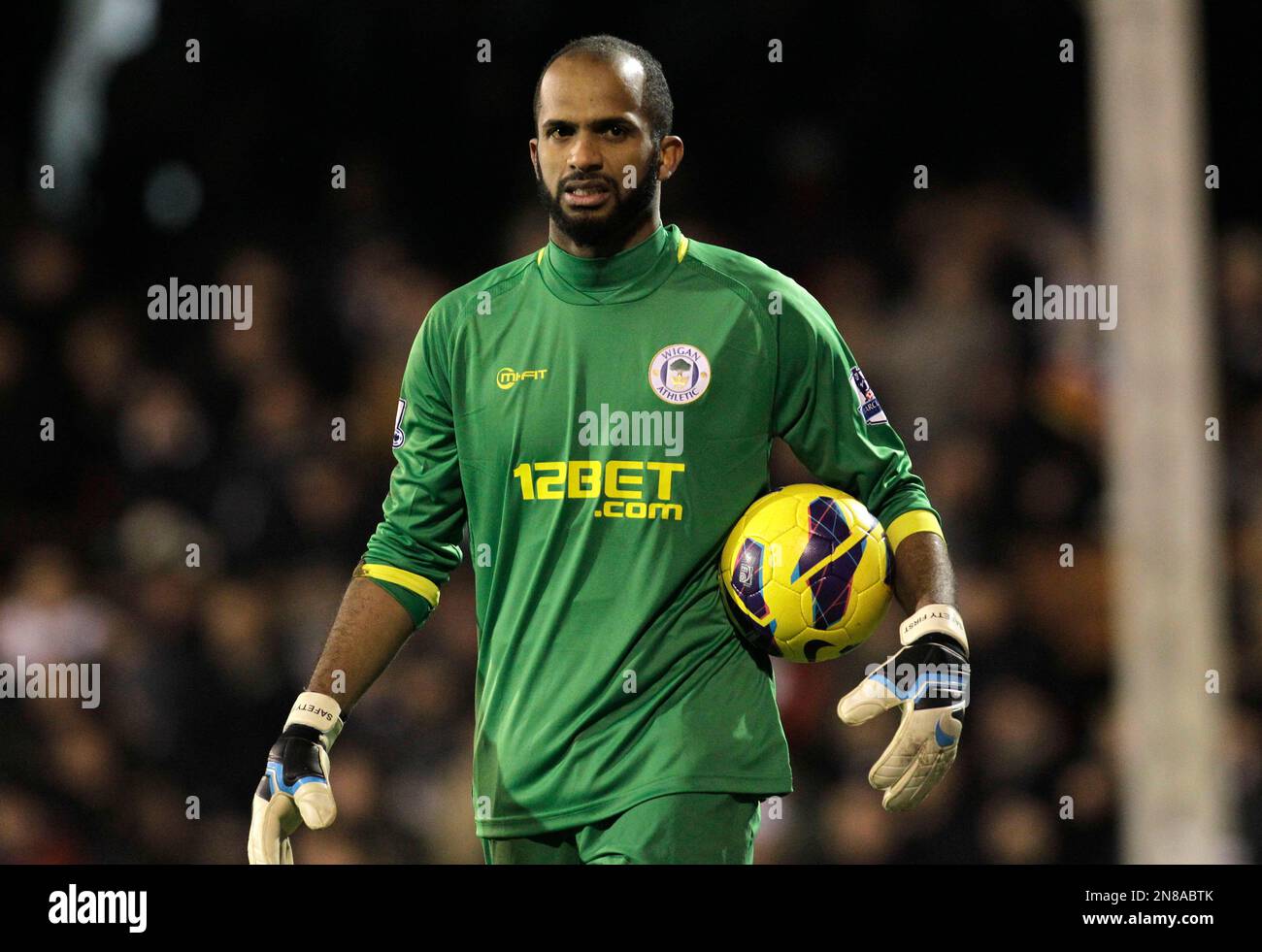 Wigan Athletic's goalkeeper Ali Al Habsi plays against Fulham during ...