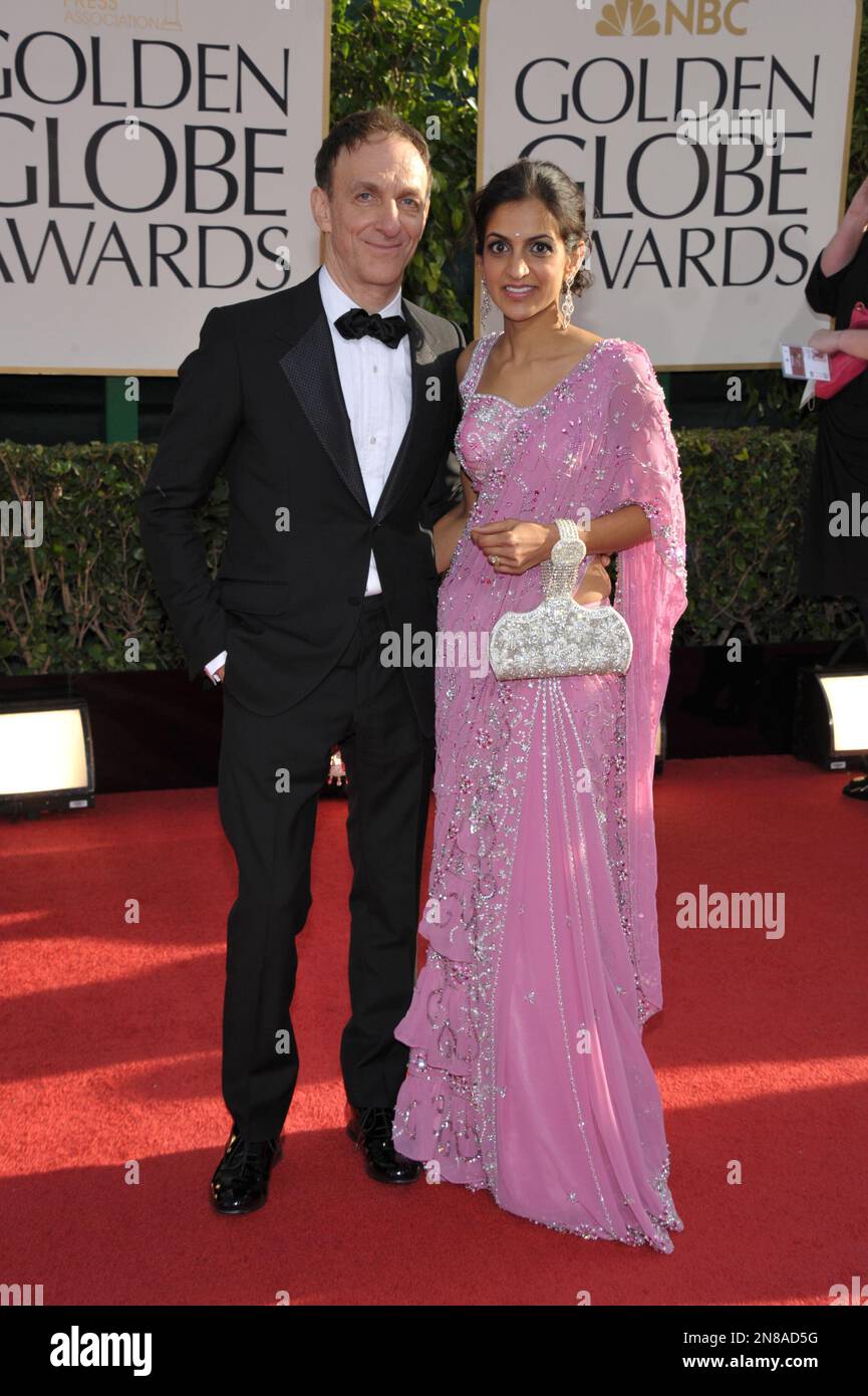 Mychael Danna and guest arrive at the 70th Annual Golden Globe Awards ...