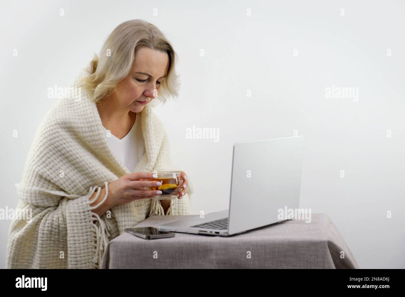 adult woman looking computer monitor looking for medicines ...