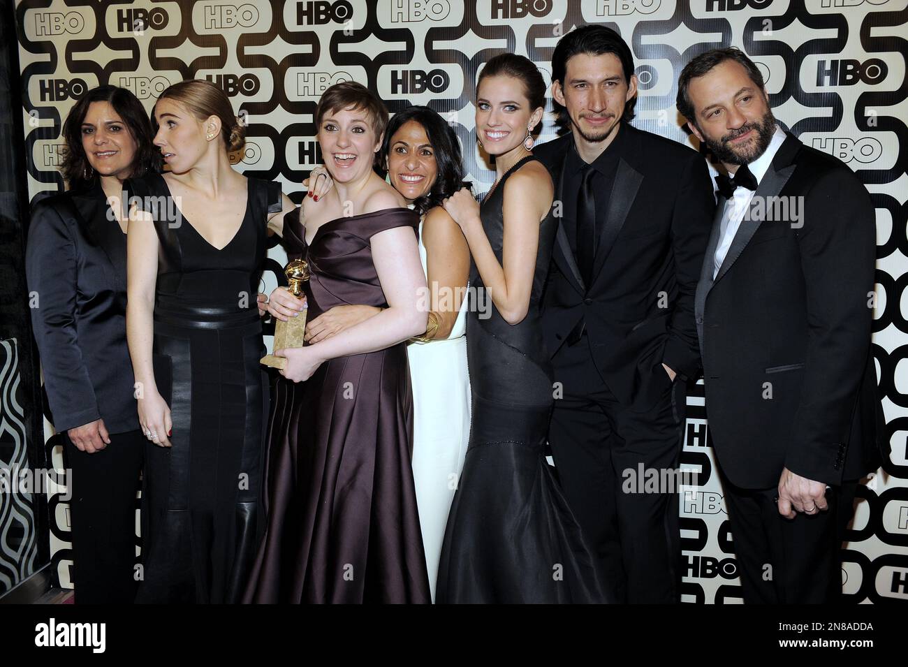 Members of the cast and crew of "Girls" pose with an award as they ...