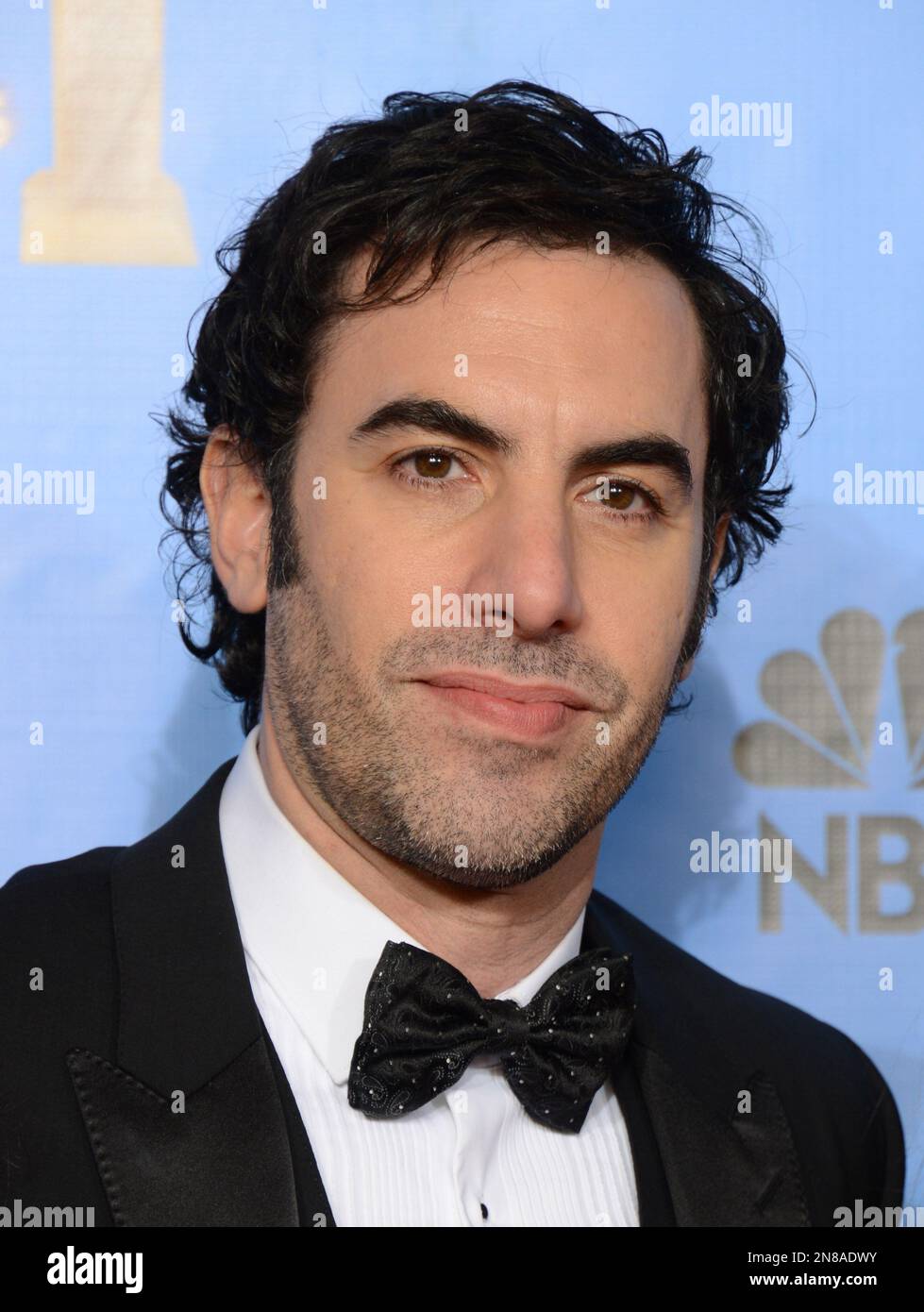 Actor Sacha Baron Cohen poses with the award for best motion picture ...