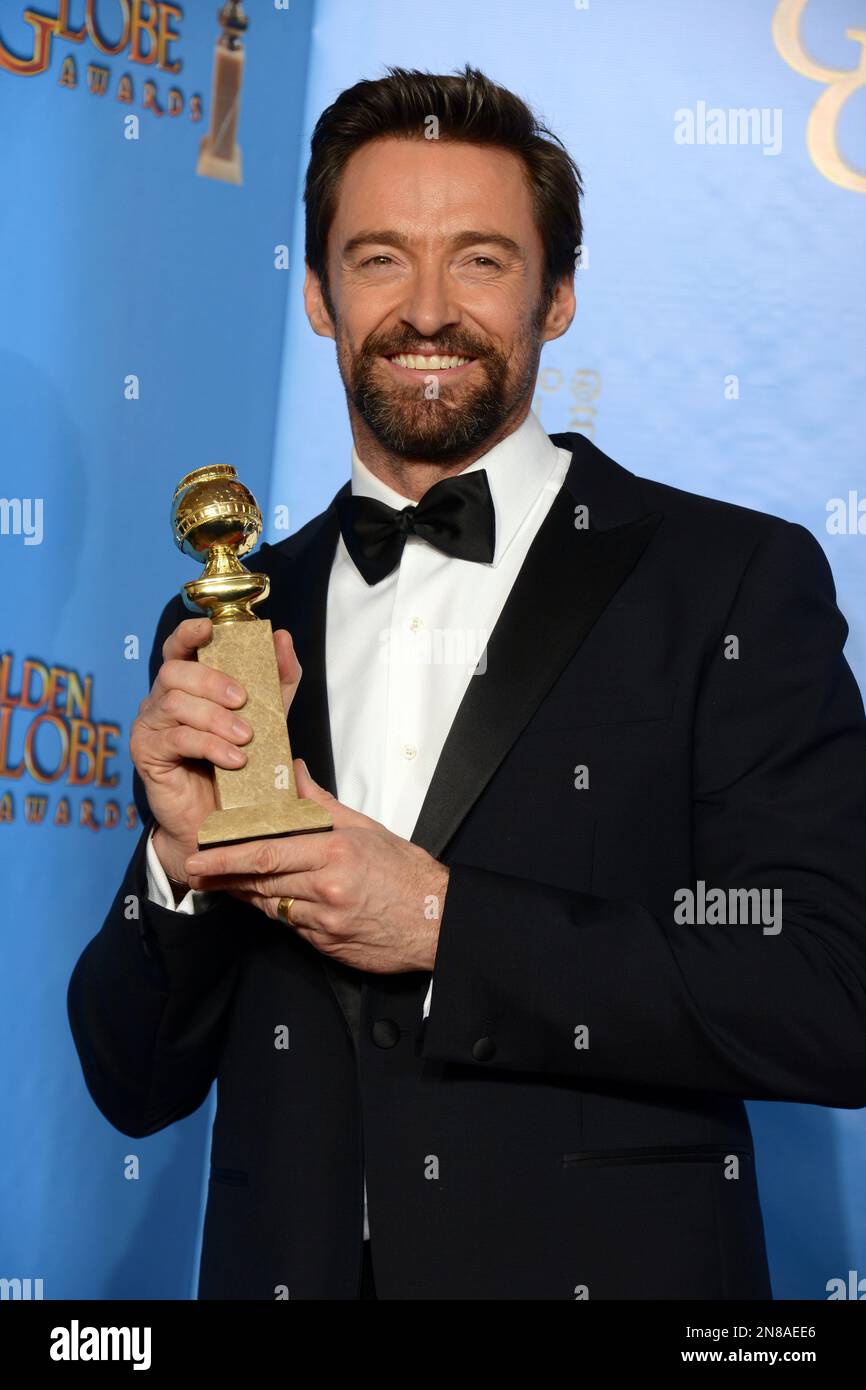 Actor Hugh Jackman poses with the award for best performance by an ...