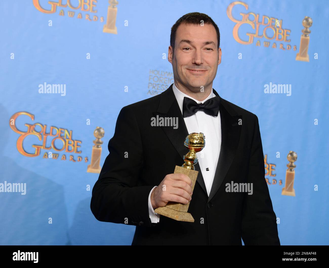 Director Mark Andrews poses with the award for best animated feature ...