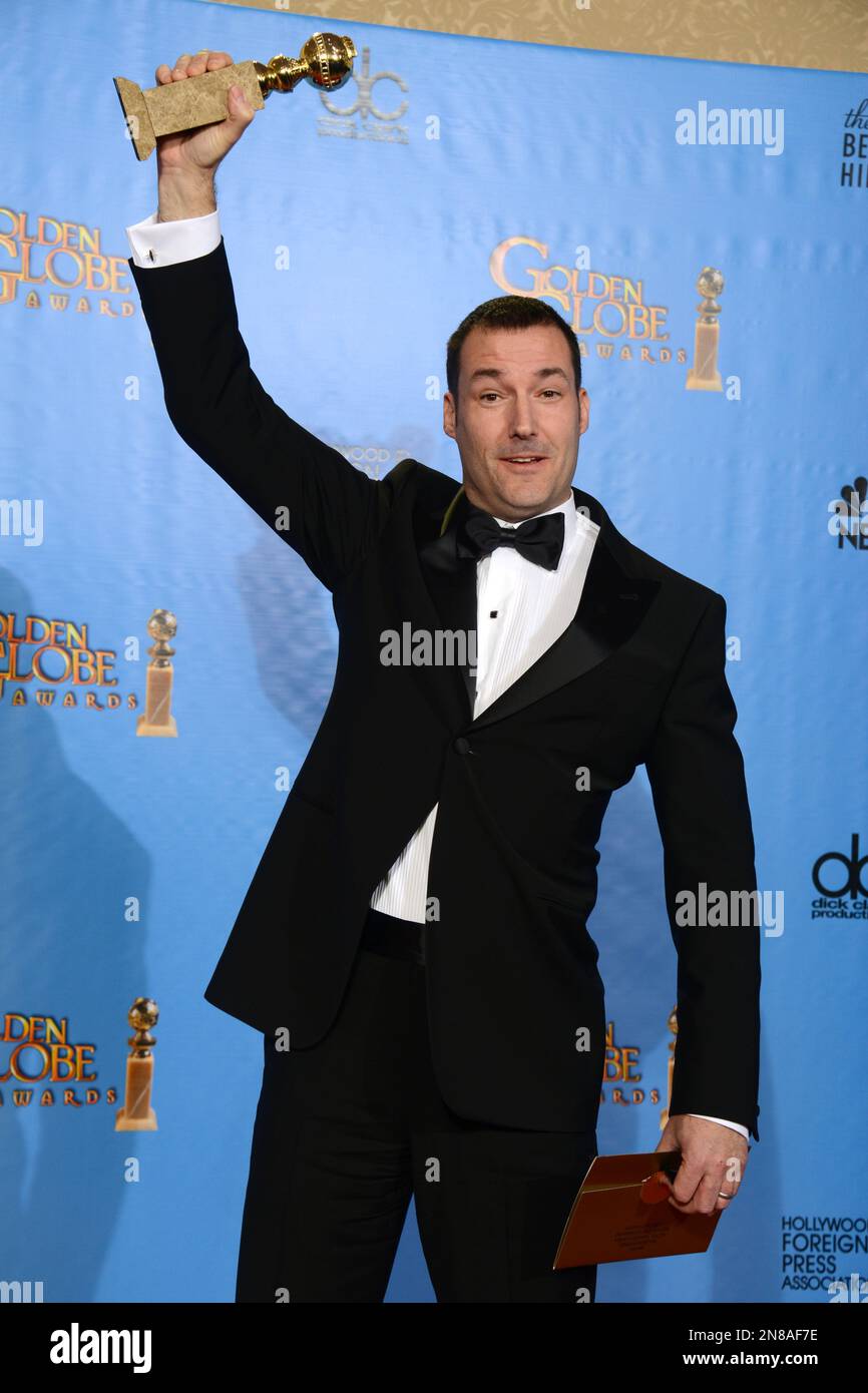 Director Mark Andrews poses with the award for best animated feature ...