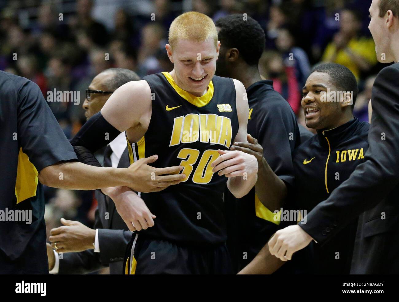 Iowa forward Aaron White (10) celebrates with teammates during the ...