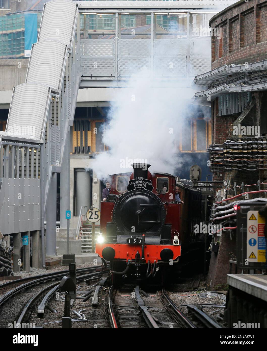 Metropolitan 1, a restored steam train built in 1898, passes through ...