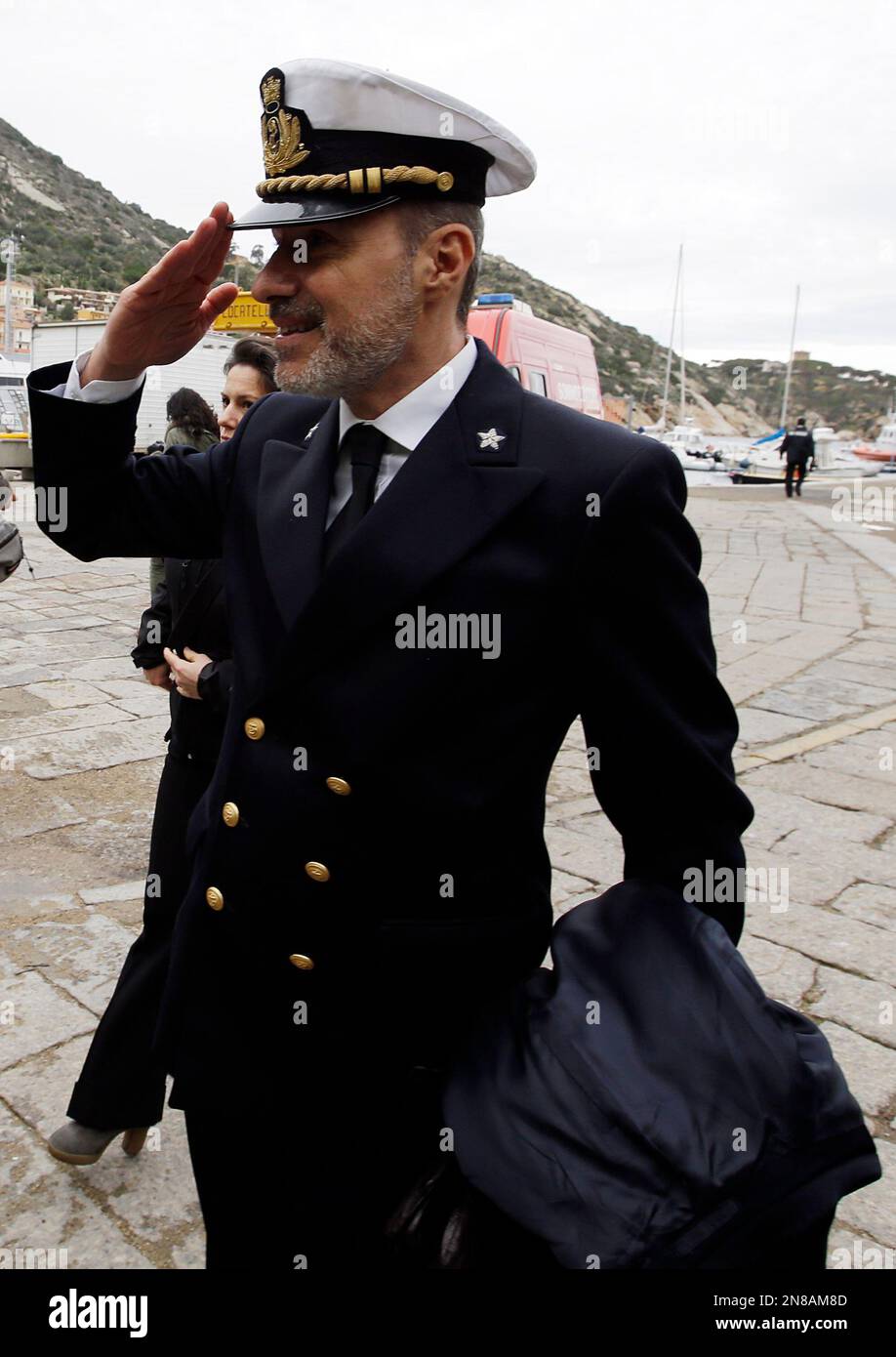 Italian Coast Guard Capt. Gregorio De Falco salutes as he arrives on ...
