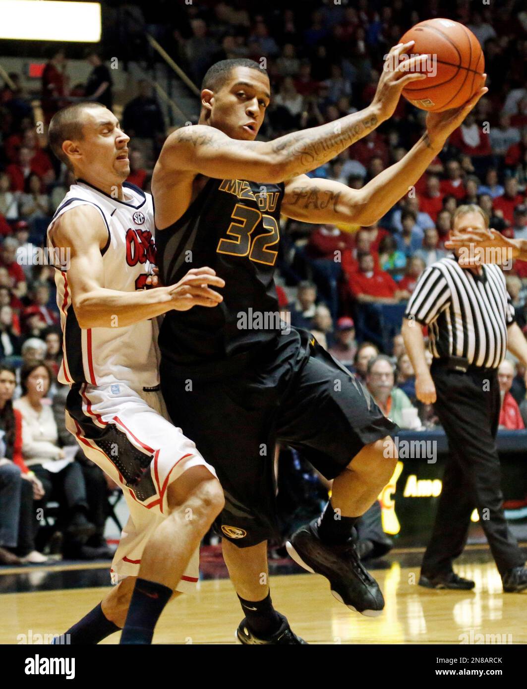 Missouri guard Jabari Brown (32) tries to shoot around Mississippi ...