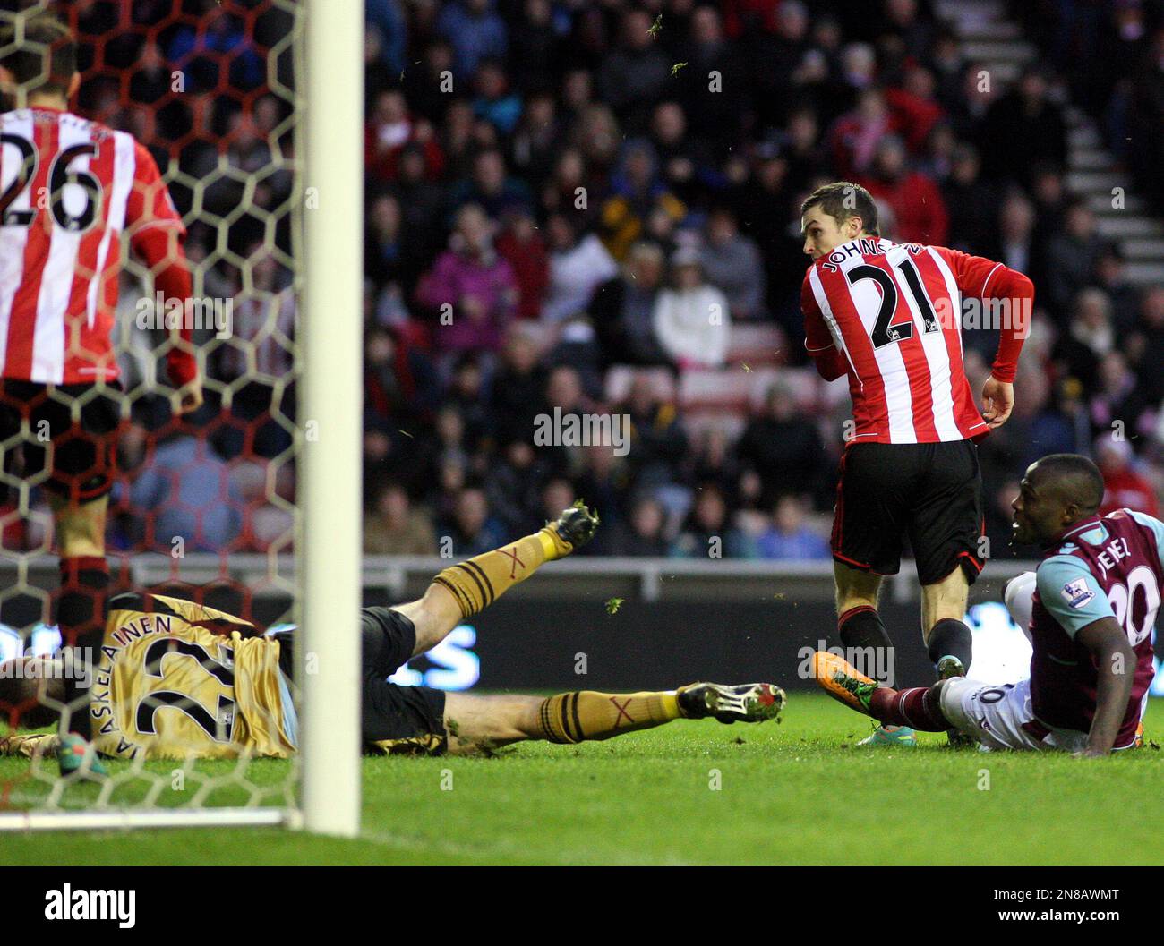 Sunderland's Adam Johnson, center, scores his goal past West Ham United ...