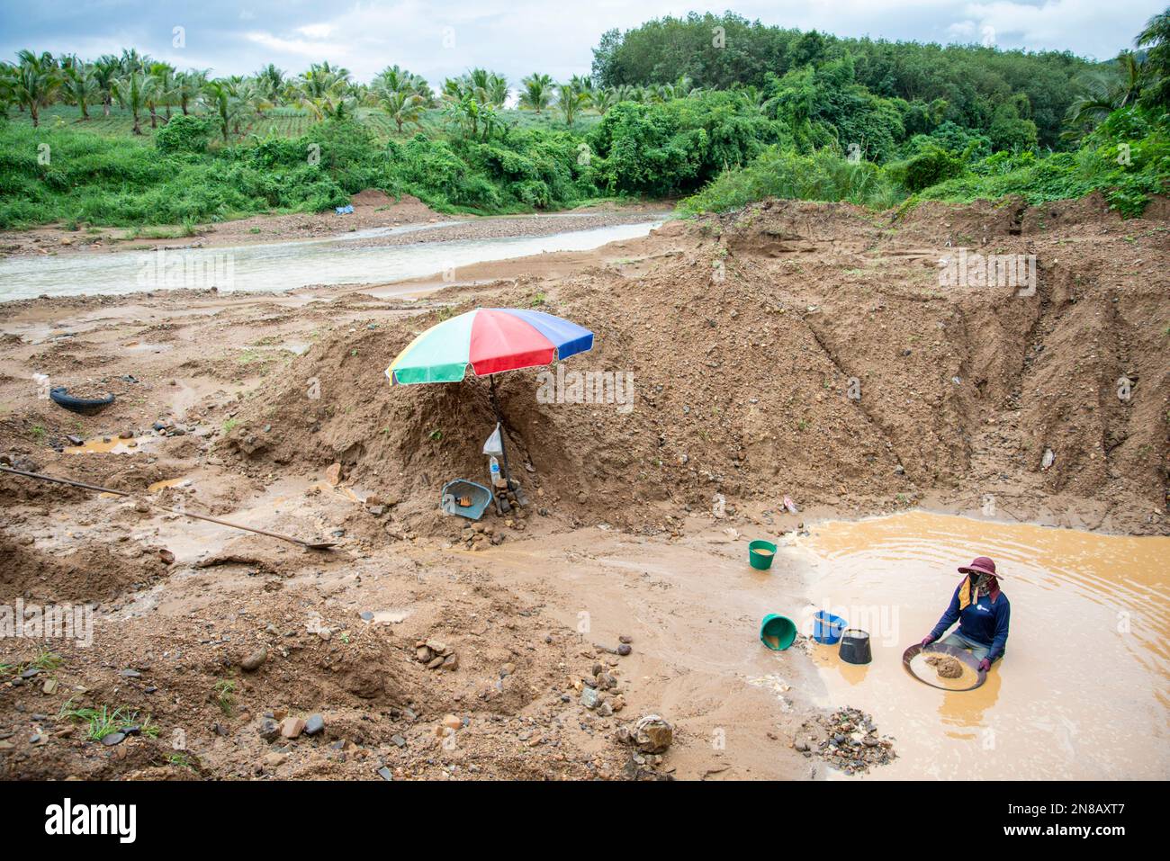 people are Gold washing at the Klong Thong River at tambon Ron Thong ...