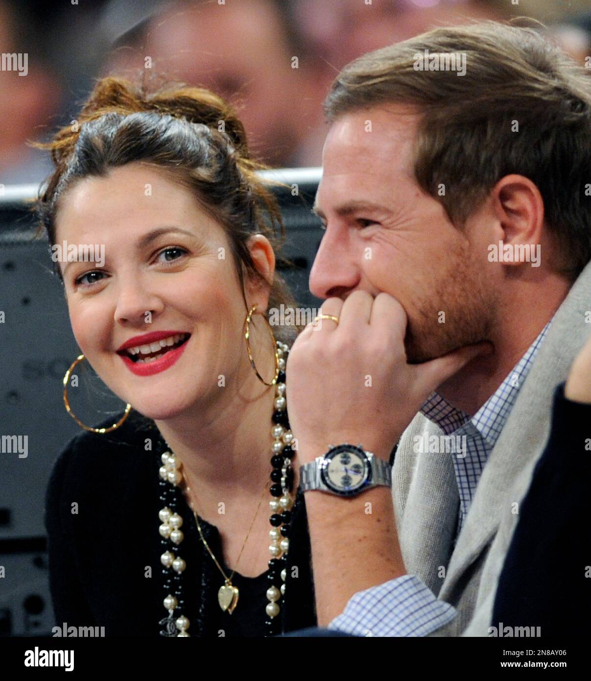 Actress Drew Barrymore, left, and her husband Will Kopelman watch the ...