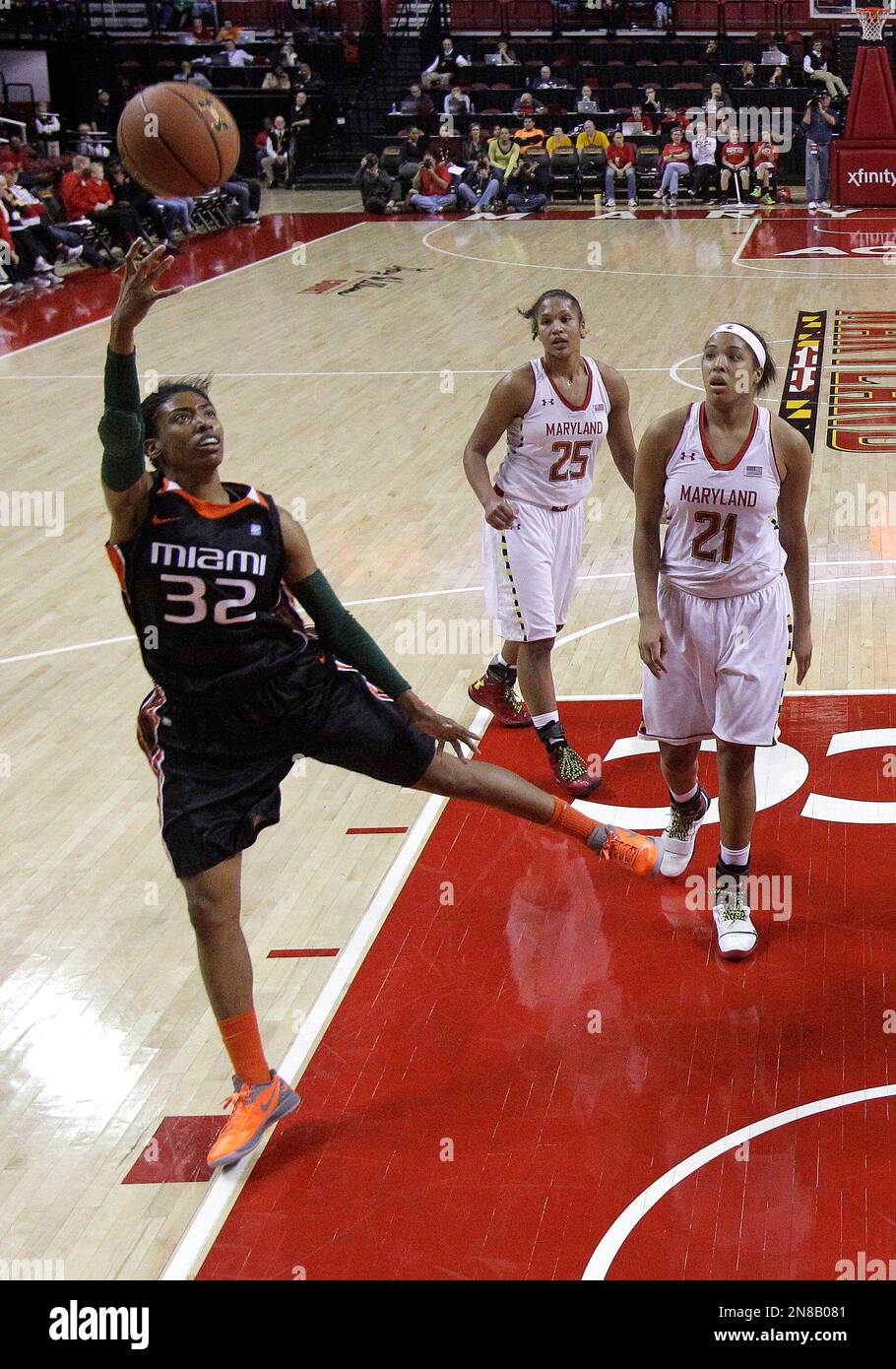 Miami forward Morgan Stroman (32) shoots past Maryland forwards Alyssa ...