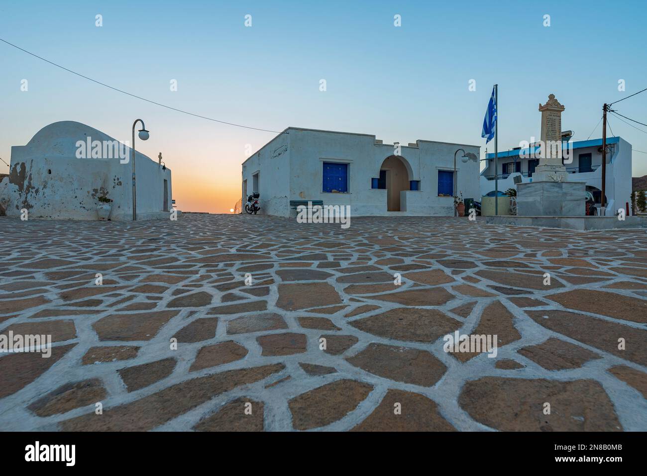 The sunset seen from the main square of Chora village, Anafi Stock ...