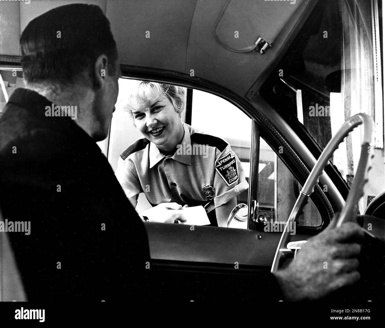 Julia Marie Clay collects tolls at the Willow Grove, Pa., interchange ...
