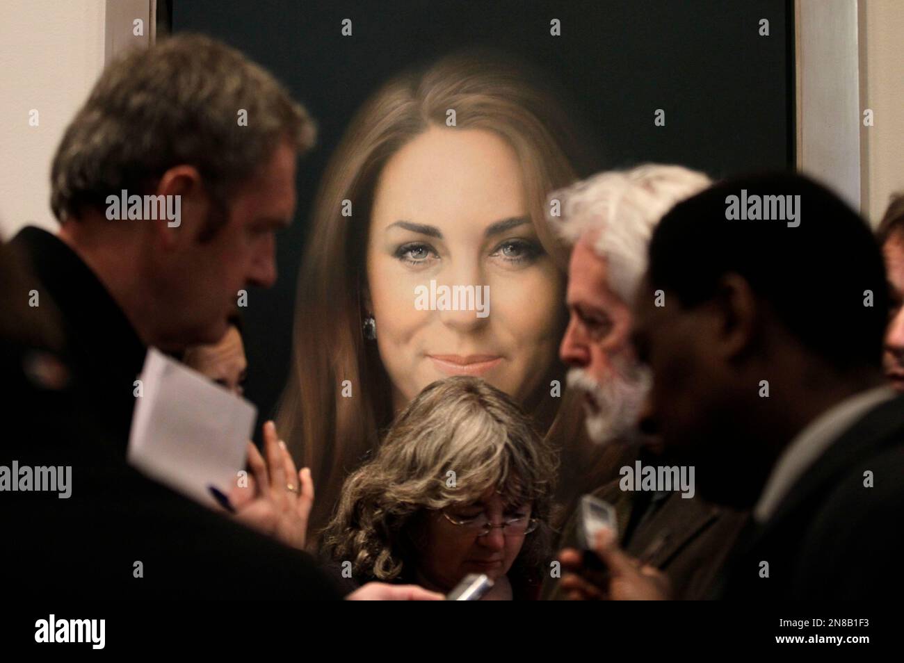 Members of the media talk to artist Paul Emsley, center right, in front ...