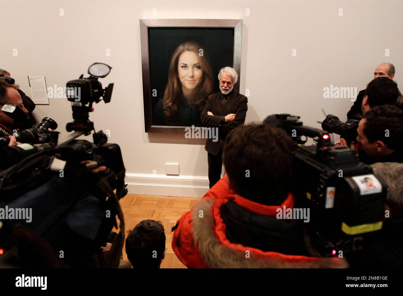Artist Paul Emsley poses for photographers next to his newly ...