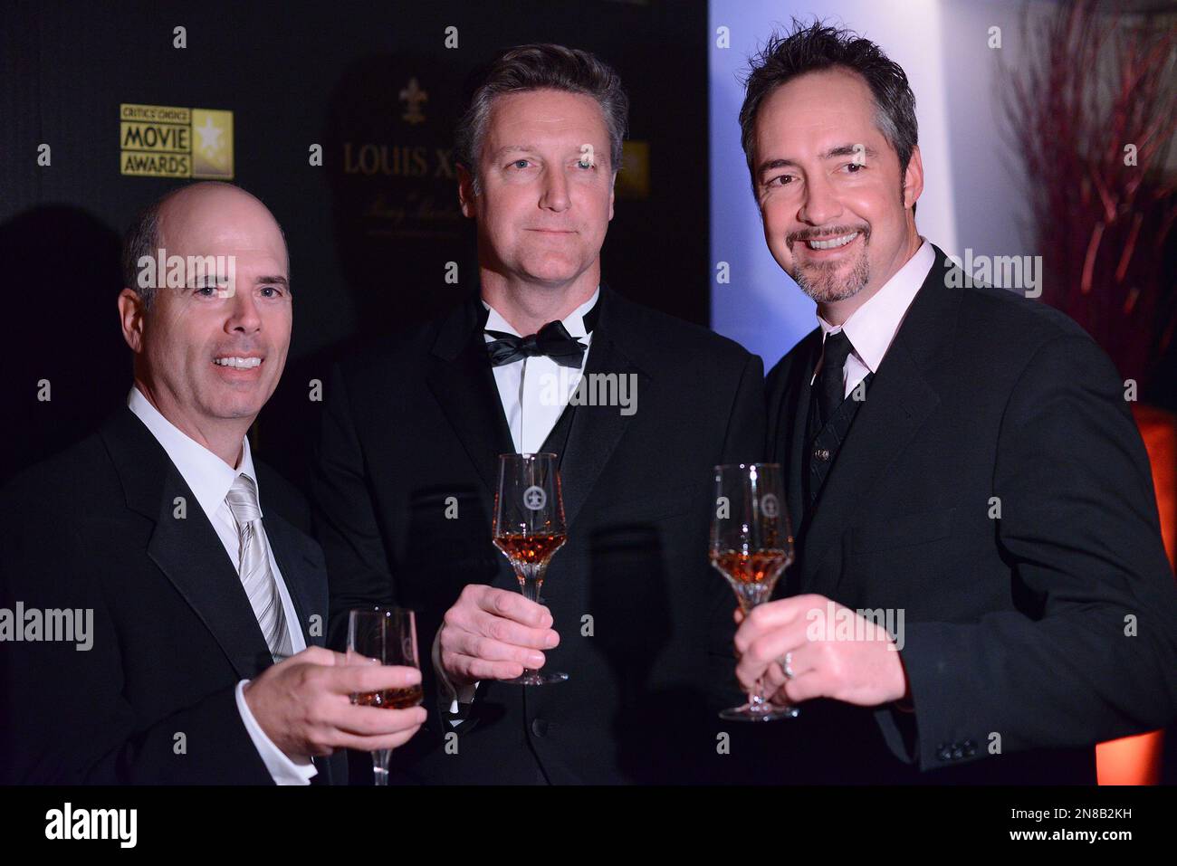 From left, Joey Berlin, Yves DeLaunay and guest toast the Critics ...