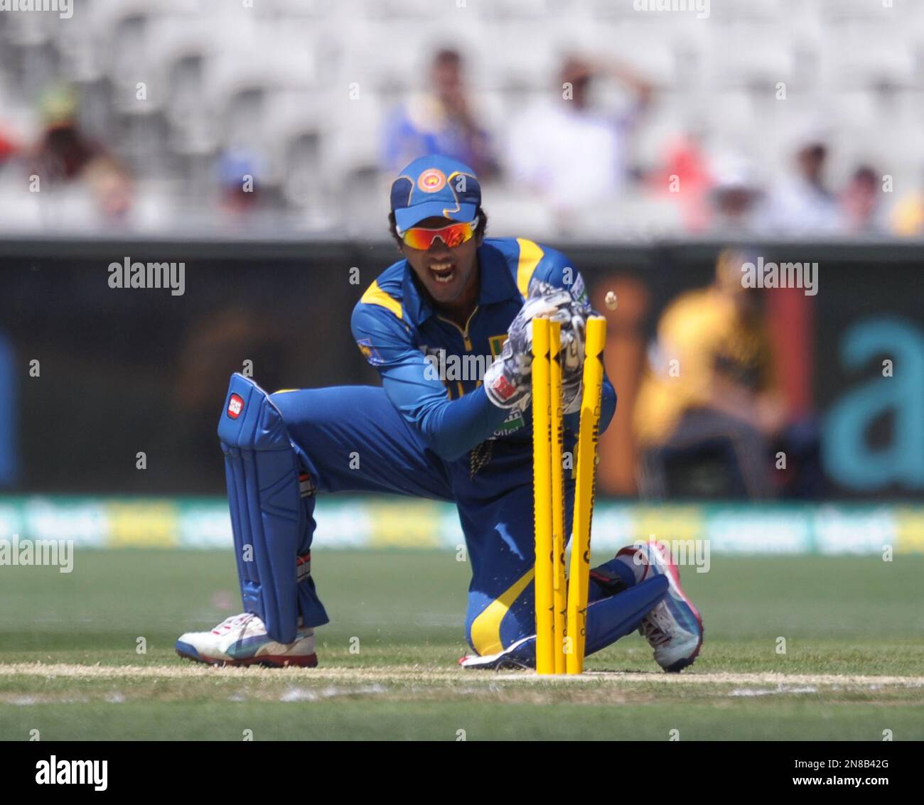 Sri Lanka's Dinesh Chandimal runs out Australia's Usman Kawaja during ...