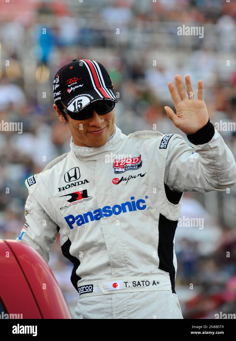 FILE - In a June 9, 2012 file photo, Takuma Sato, of Japan, waves ...