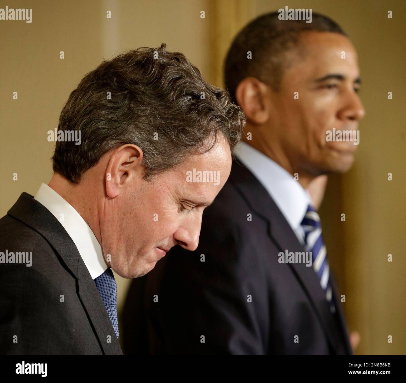 Outgoing Treasury Secretary Timothy Geithner listens at left while ...