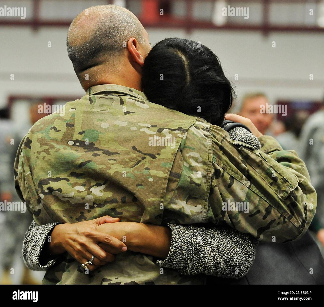 South Carolina Gov. Nikki Haley, right, hugs her husband, Capt. Michael ...