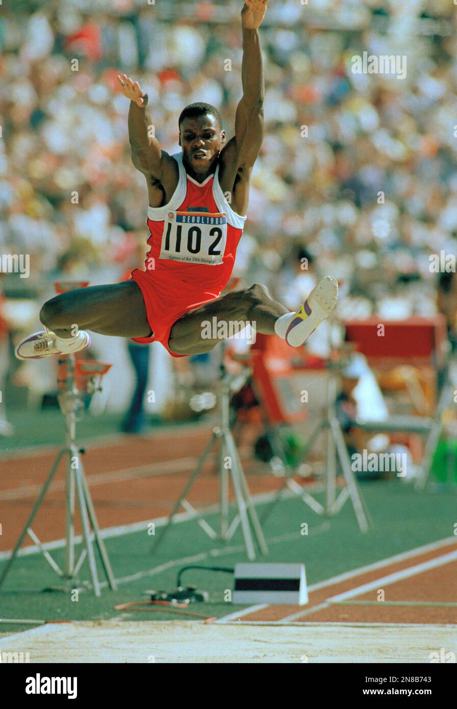Carl Lewis performs his winning jump to capture a gold medal in the ...