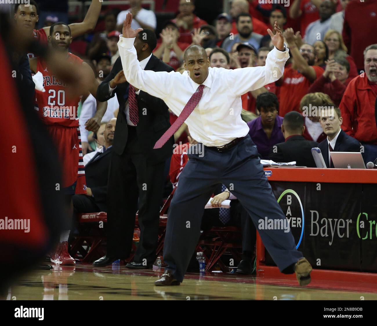 Fresno State's coach Rodney Terry cheers on his team against San Diego ...