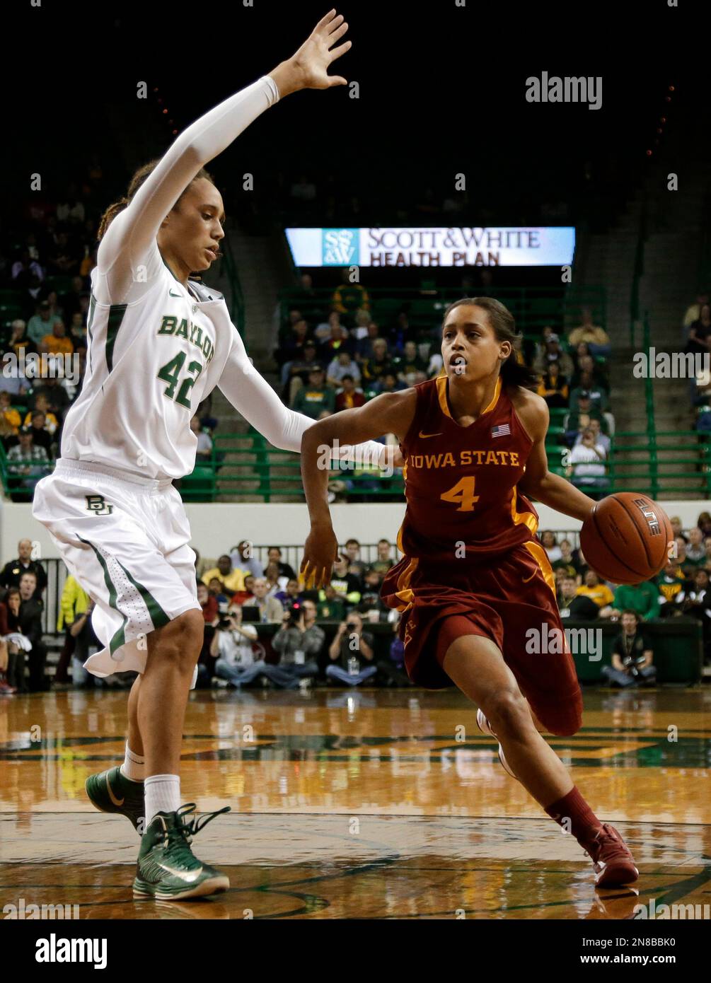 Iowa State's Nikki Moody (4) drives to the basket past Baylor's ...