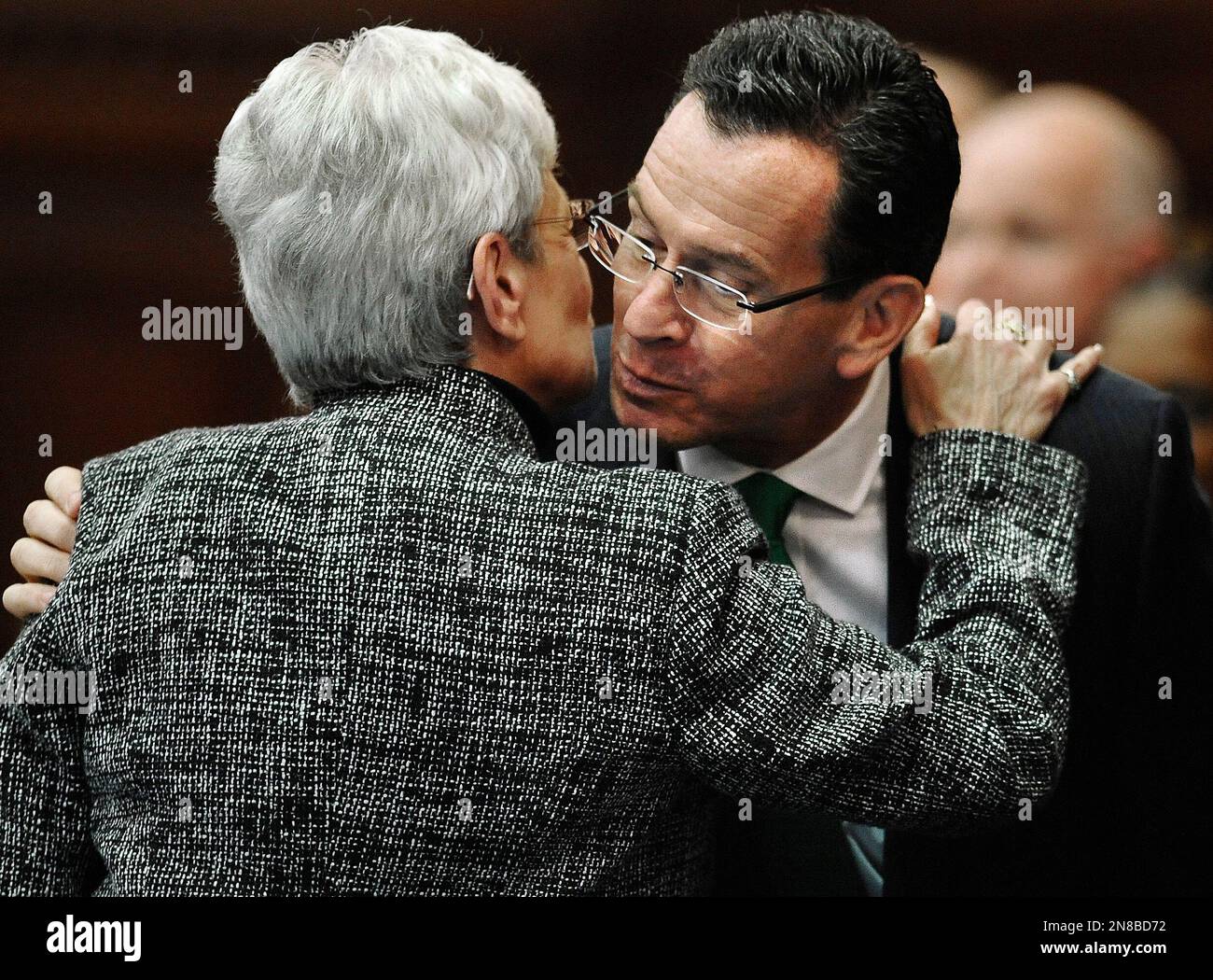 Connecticut Gov. Dannel P. Malloy, right, is embraced by Lt. Gov. Nancy ...