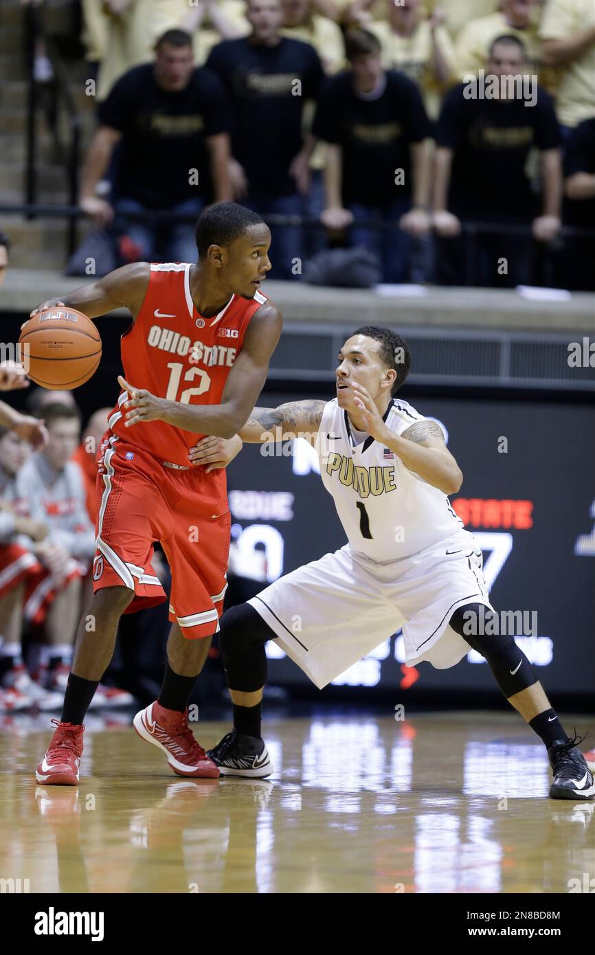 Purdue guard Anthony Johnson, right, guards Ohio State forward Sam ...