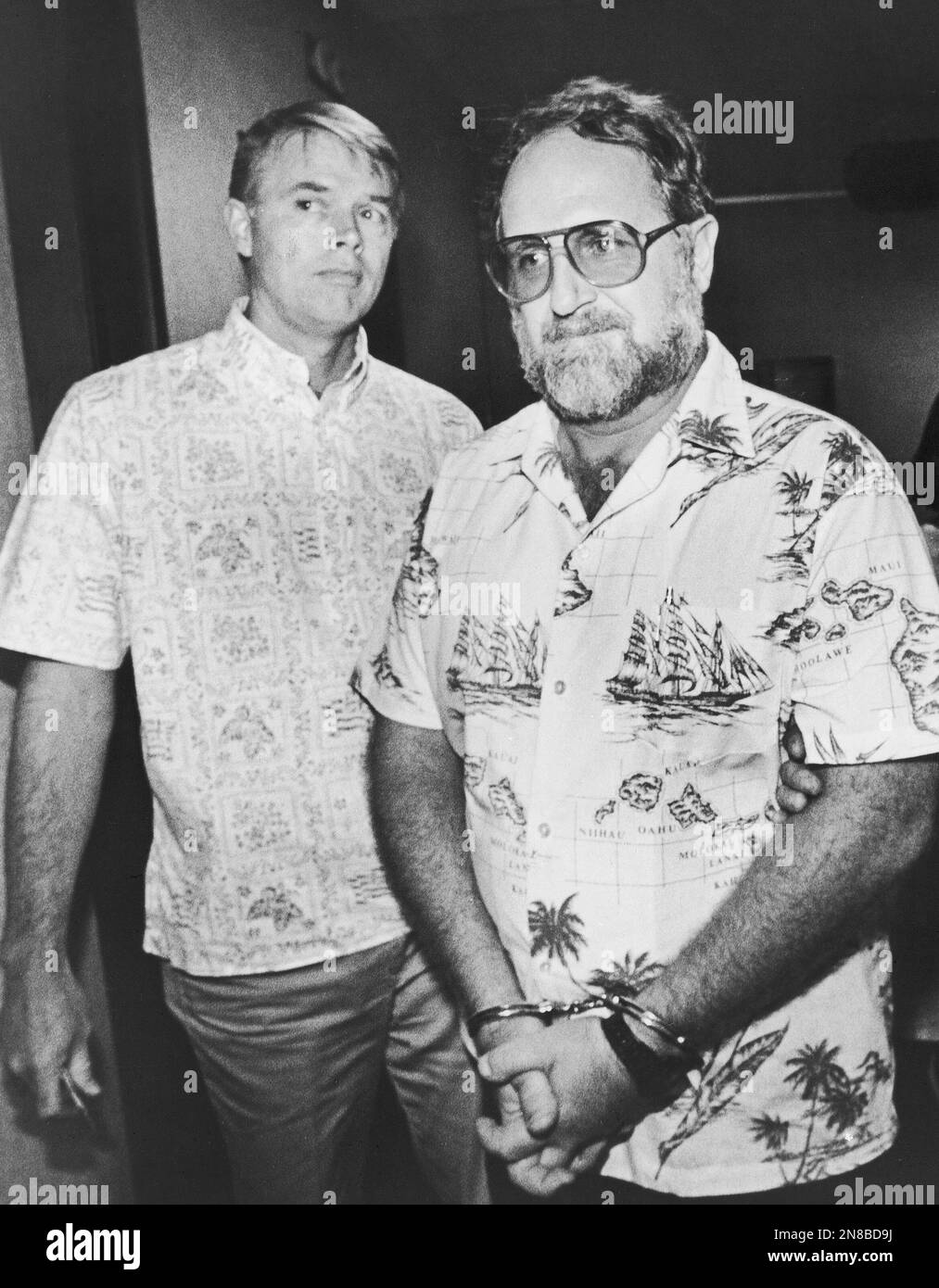 Suspected murder, David Davis, is shown under arrest after being caught ...