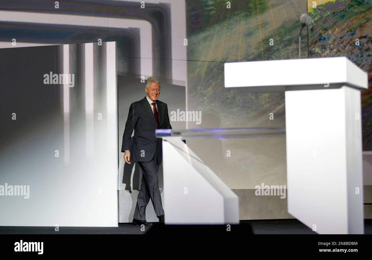 Former President Bill Clinton walks toward the podium for his speech ...