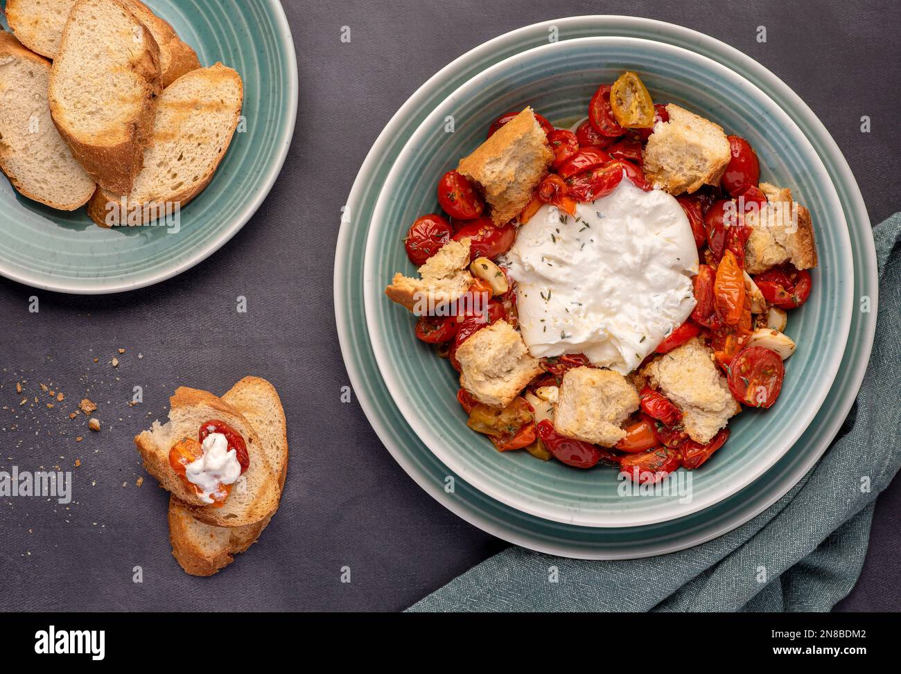 Food photography of baked tomatoes, soft, cheese, burrata, mozzarella ...