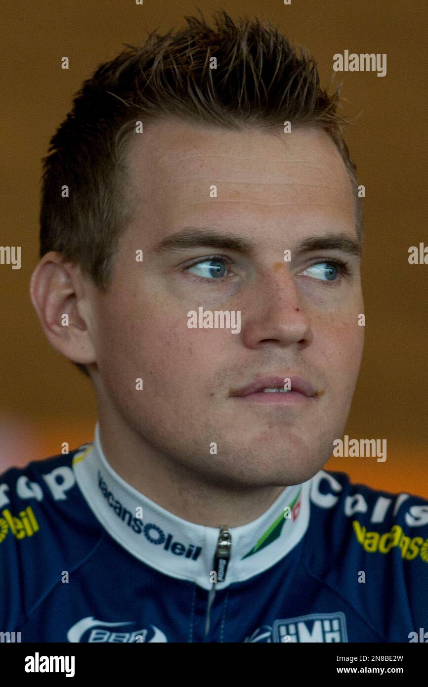 Rob Ruijgh of The Netherlands sits with other riders during the ...