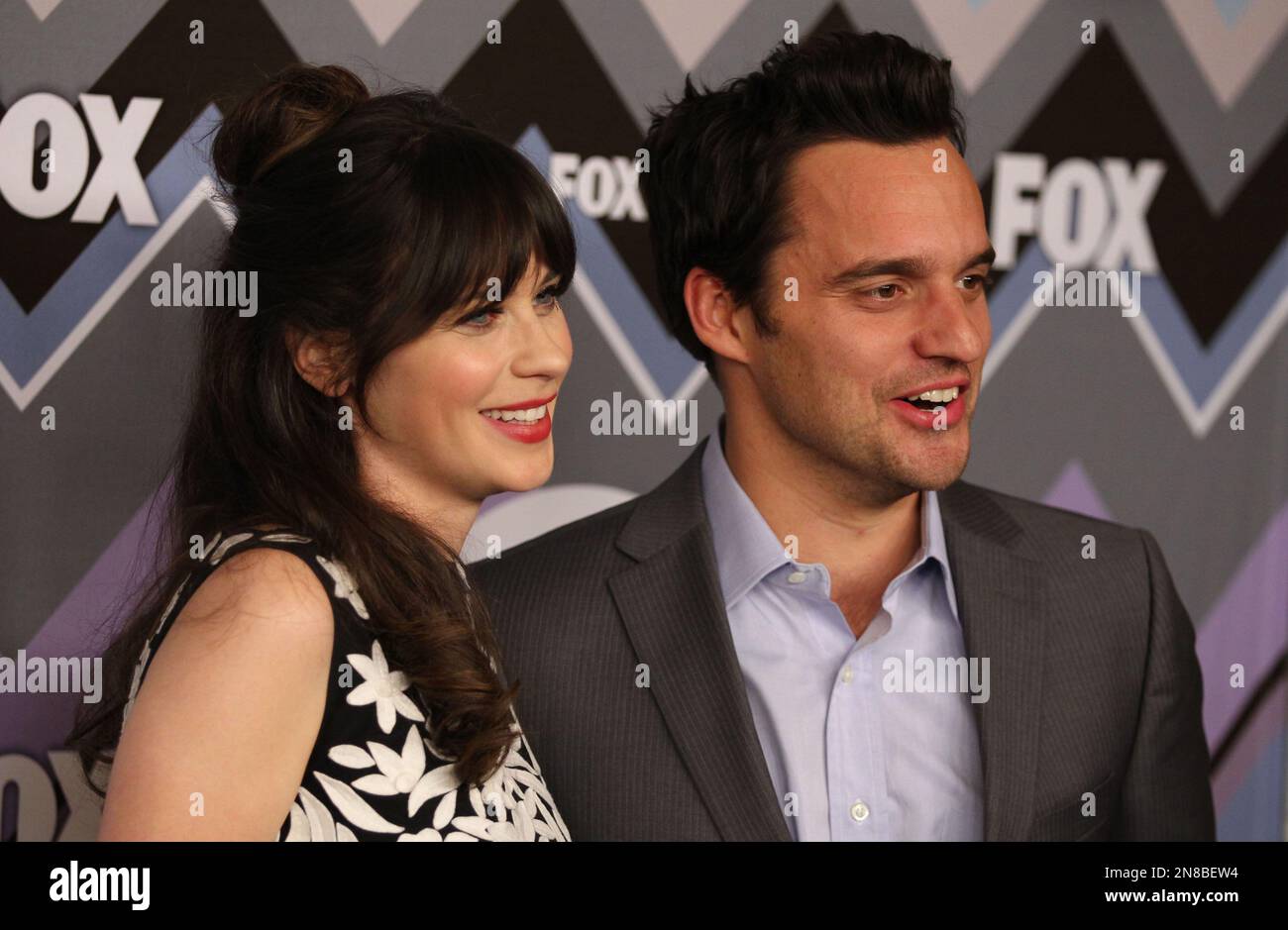 Zooey Deschanel, left, and Jake Johnson arrive at the Winter TCA Fox ...