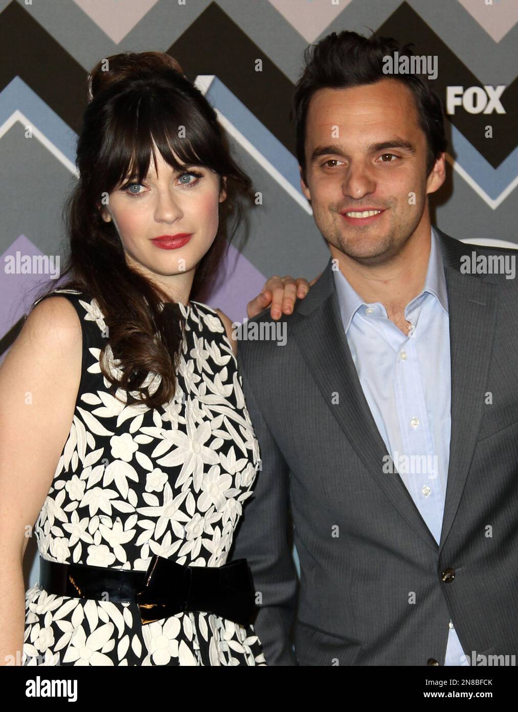 Zooey Deschanel, left, and Jake Johnson arrive at the Winter TCA Fox ...