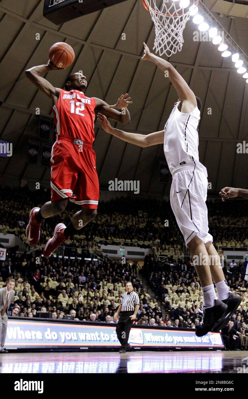 Ohio State forward Sam Thompson (12) dunks over Purdue center A.J ...