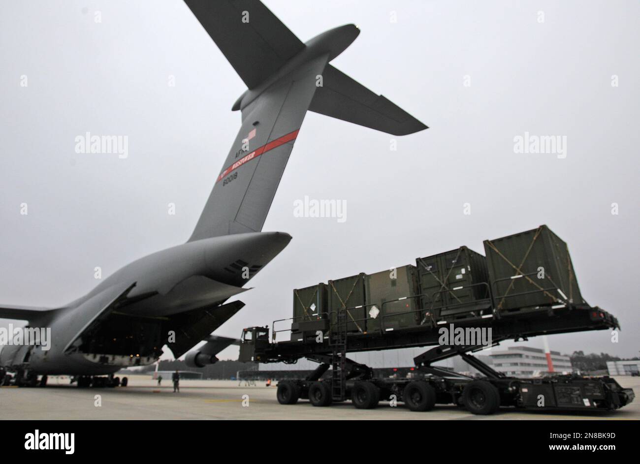 US Air Force airmen load cargo of the 10th Army Air and Missile Defense ...