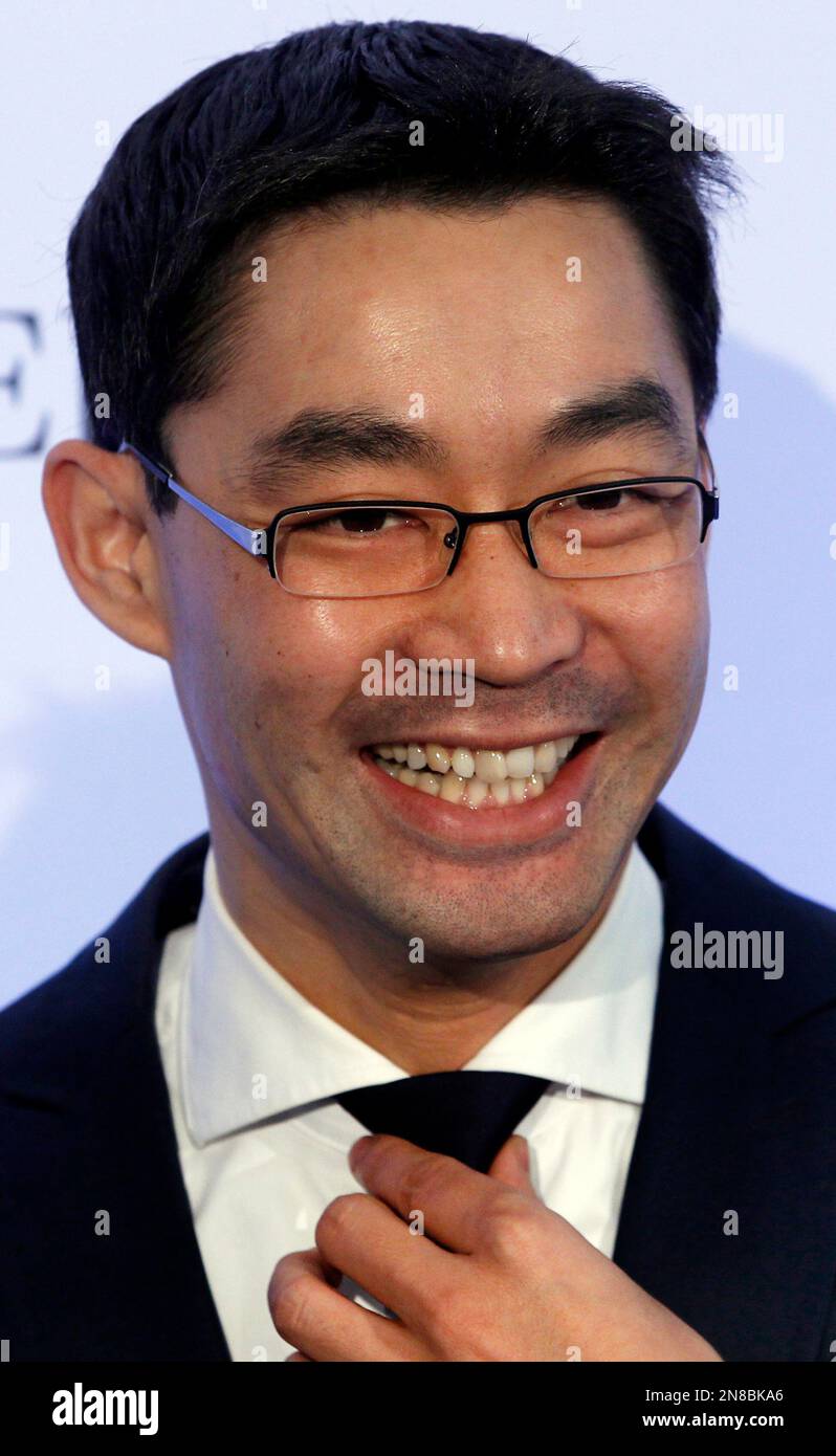 German Economy Minister Philipp Roesler smiles as he arrives for a ...