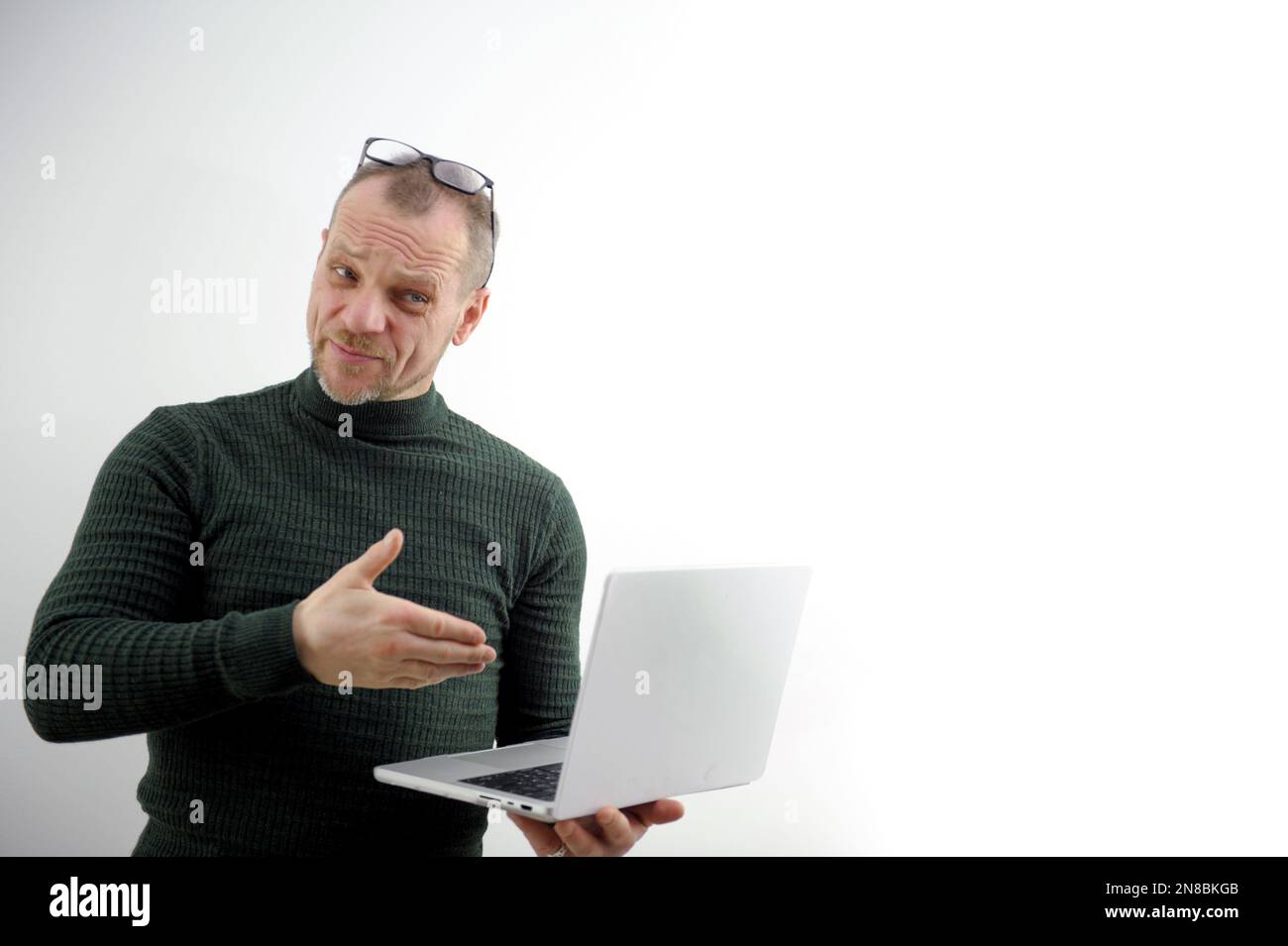 adult man persistently offers project to raise glasses to forehead to ...