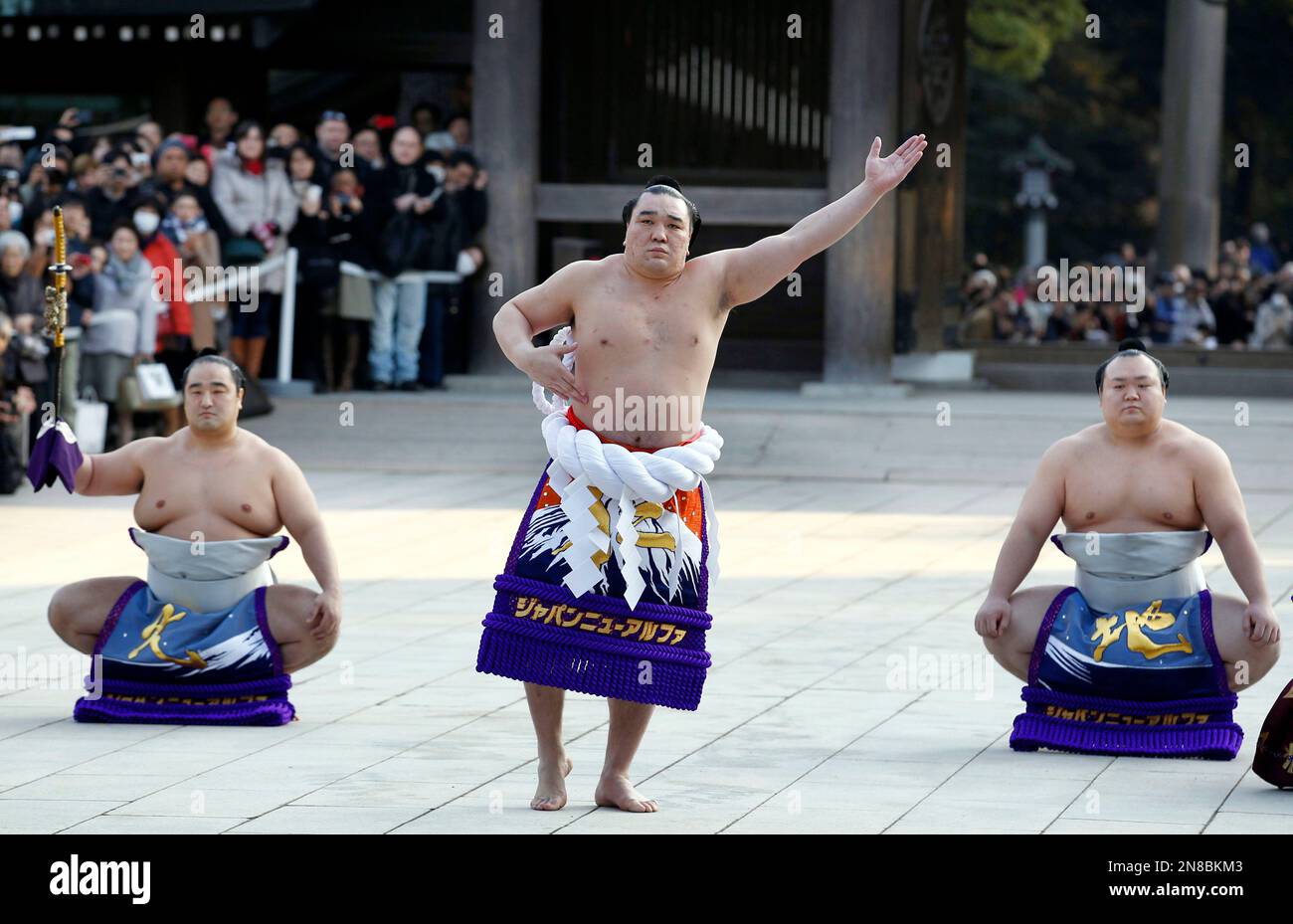 Sumo Grand champion Harumafuji, center, from Mongolia, accompanied by ...