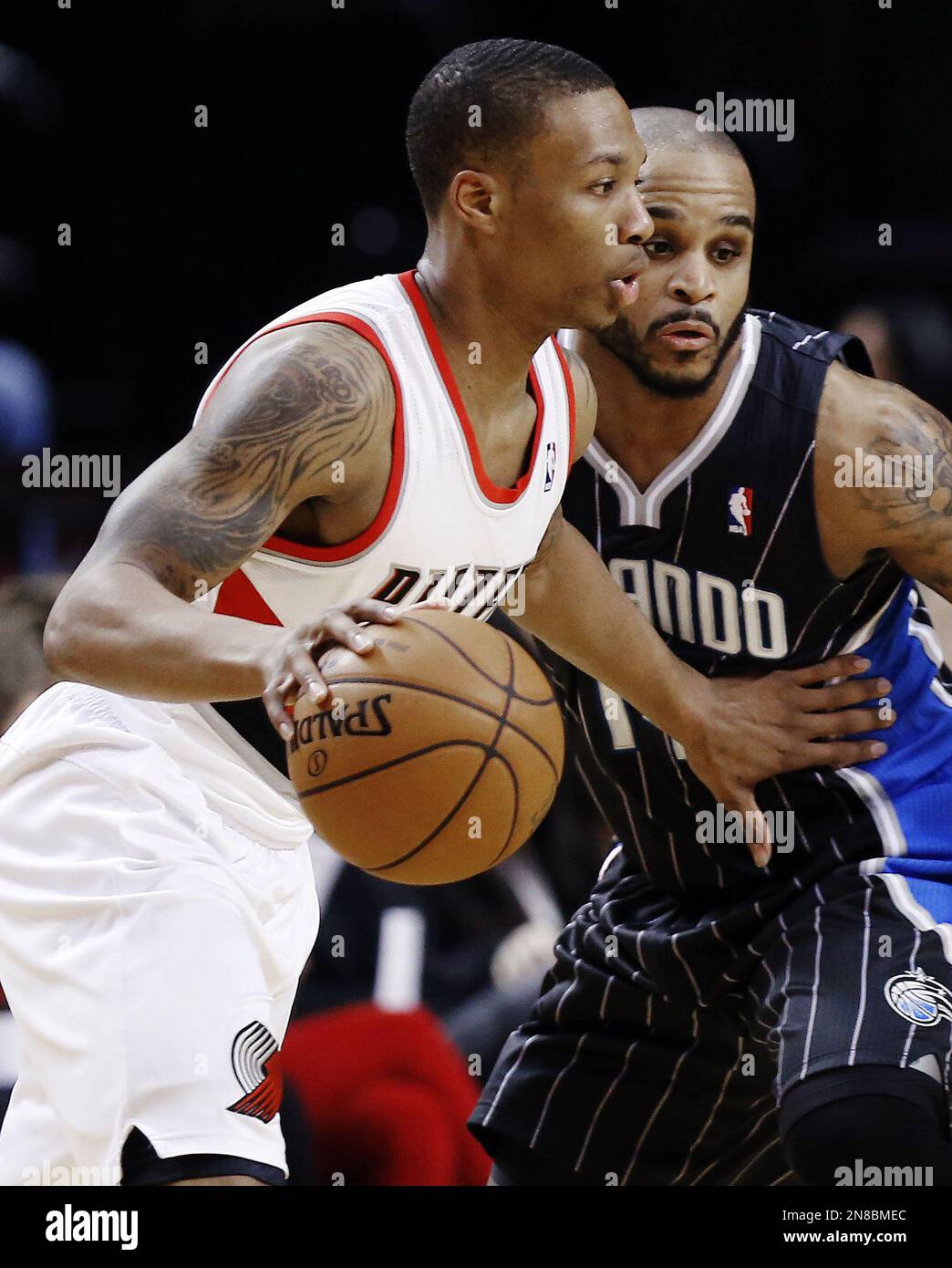 Portland Trail Blazers guard Damian Lillard, left, drives on Orlando ...