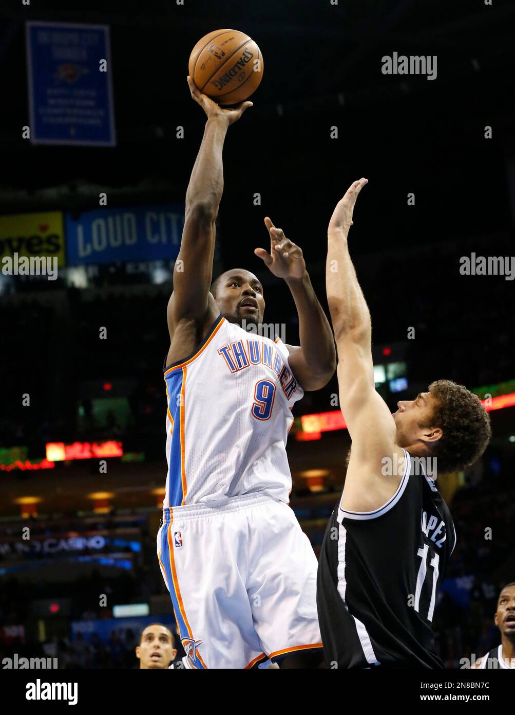 Oklahoma City Thunder forward Serge Ibaka (9) shoots over Brooklyn Nets ...