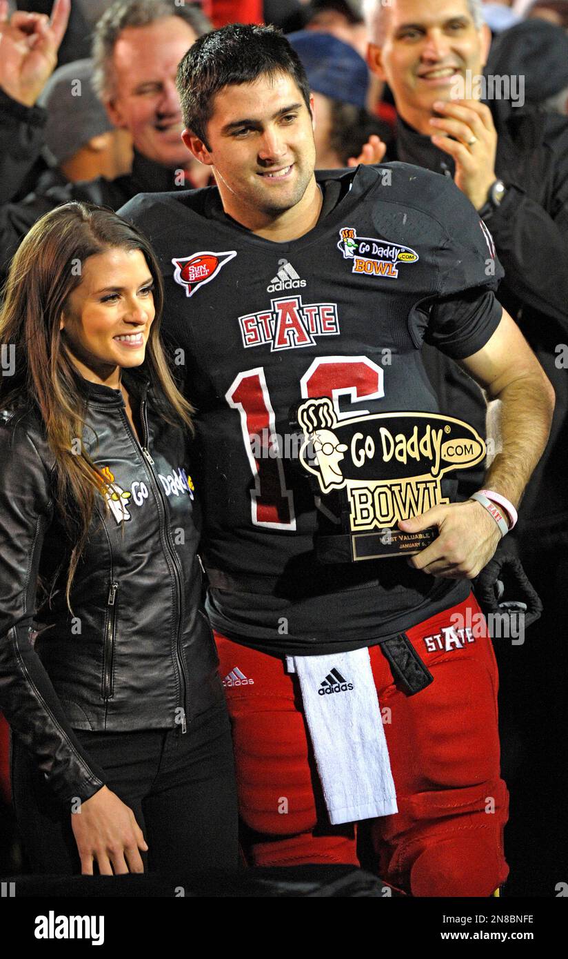 Race car drive and award presenter Danica Patrick, left, poses with ...