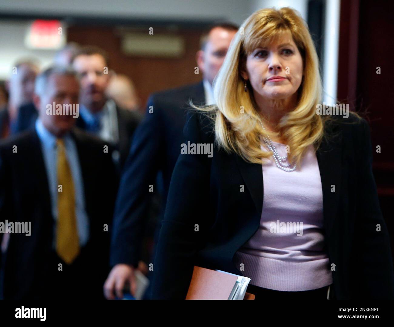Karen Pearson, the lead prosecutor, leaves with members of her team ...