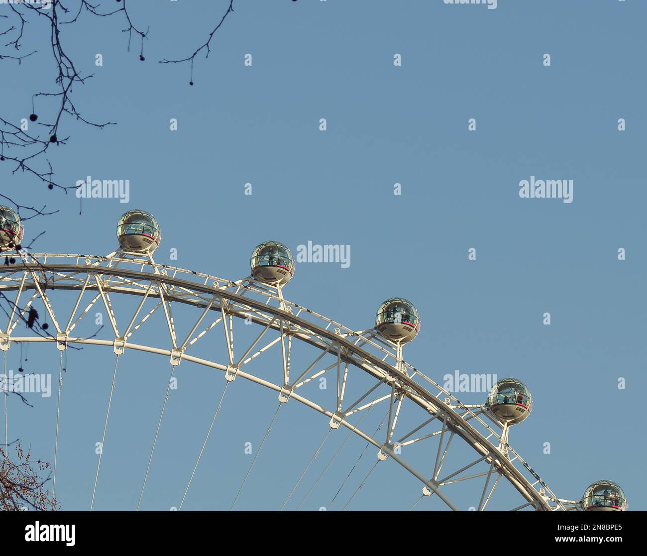 A close-up of the Millenium Wheel (London Eye), as it catches the ...