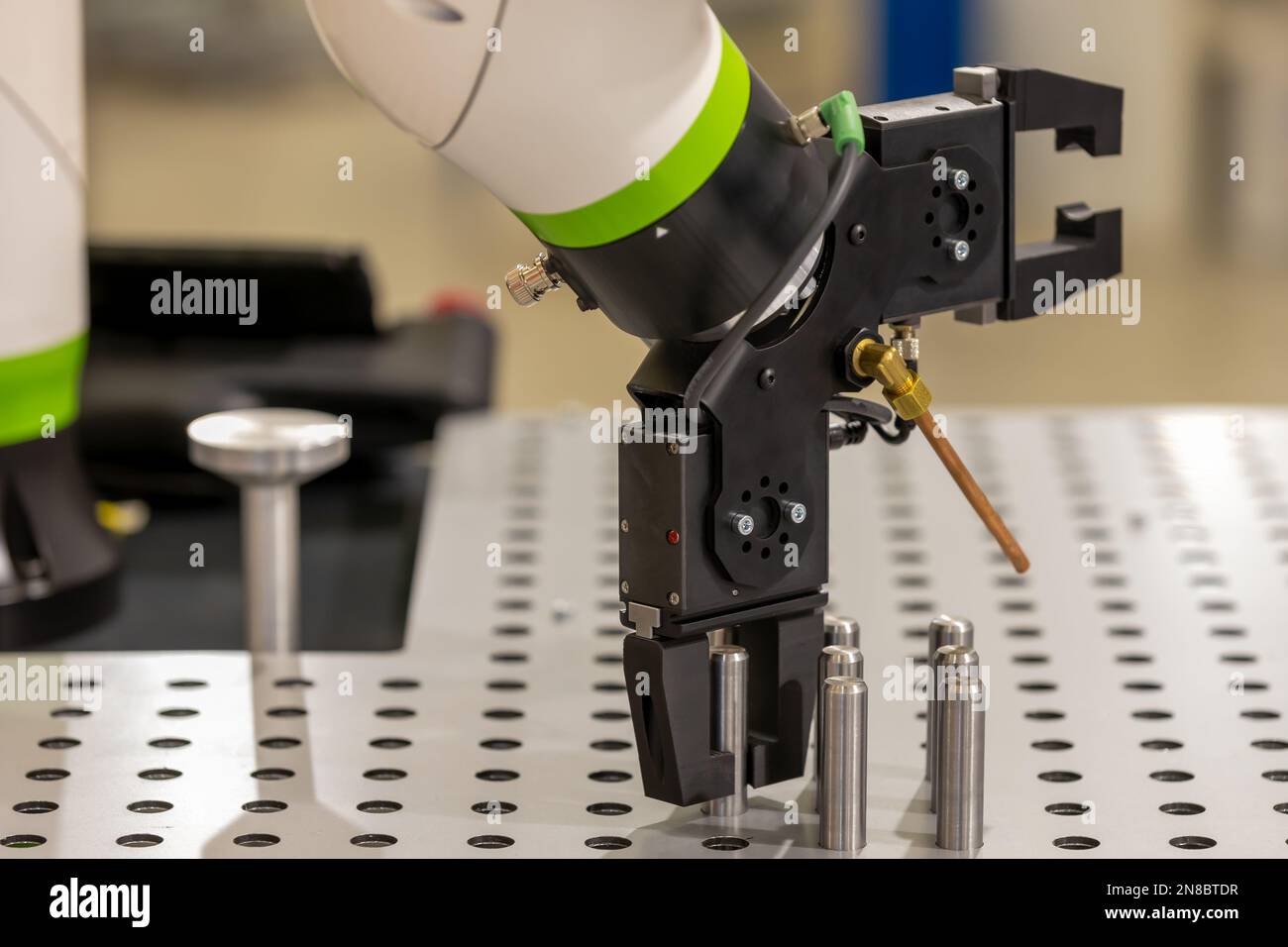 automated robotic arm grabbing pieces of iron, innovative industry ...