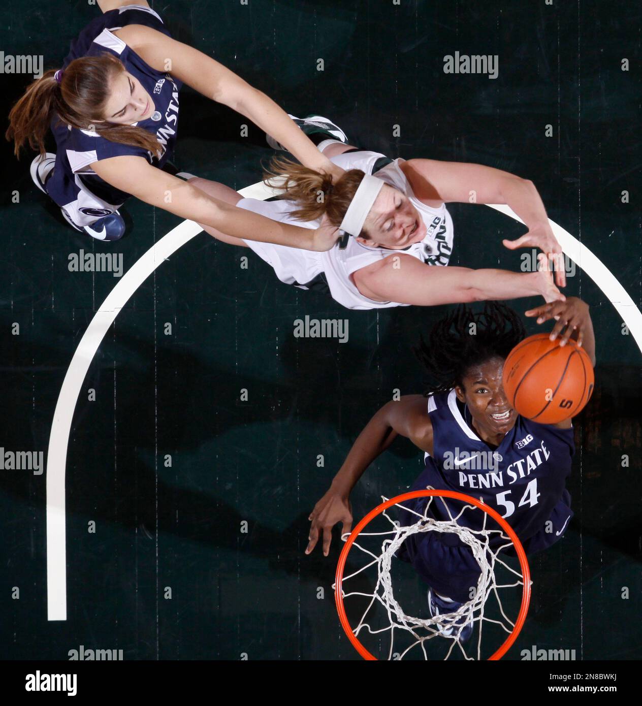 Penn State's Nikki Greene (54), Michigan State's Becca Mills, center ...