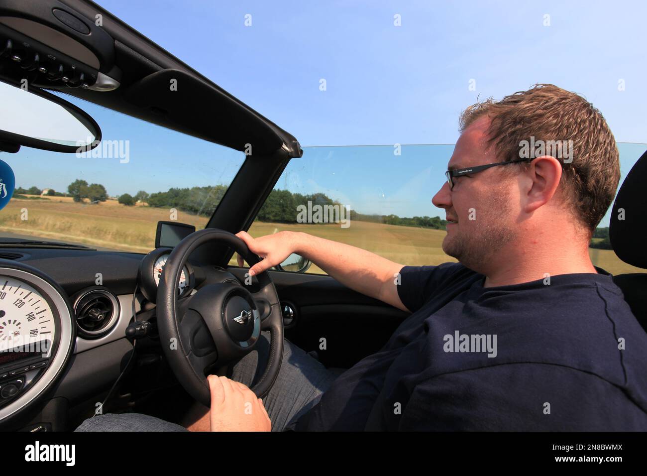 Driving mini convertible hi-res stock photography and images - Alamy