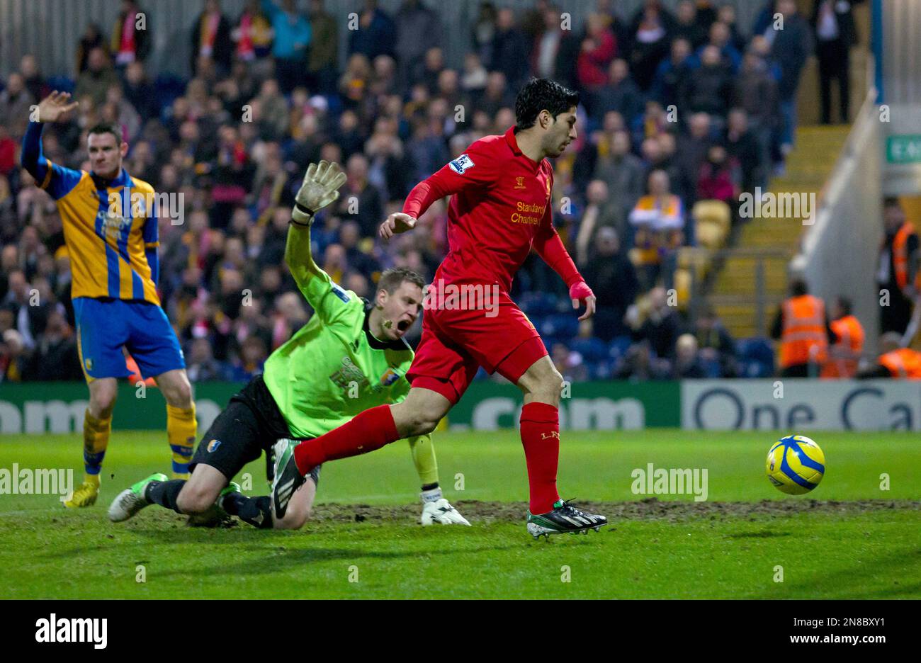 Liverpool's Luis Suarez, right, scores past Mansfield Town's goalkeeper ...
